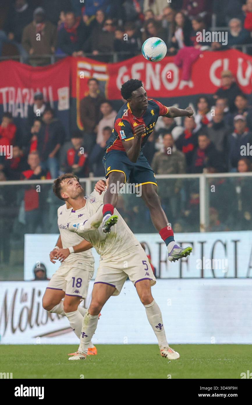 GenoaÕs Jeff Ekhator jumps for the ball during the Serie A soccer match ...