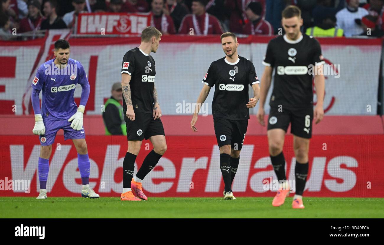 From left: goalkeeper Nikola Vasilj (St. Pauli), Eric Smith, Karol Mets ...
