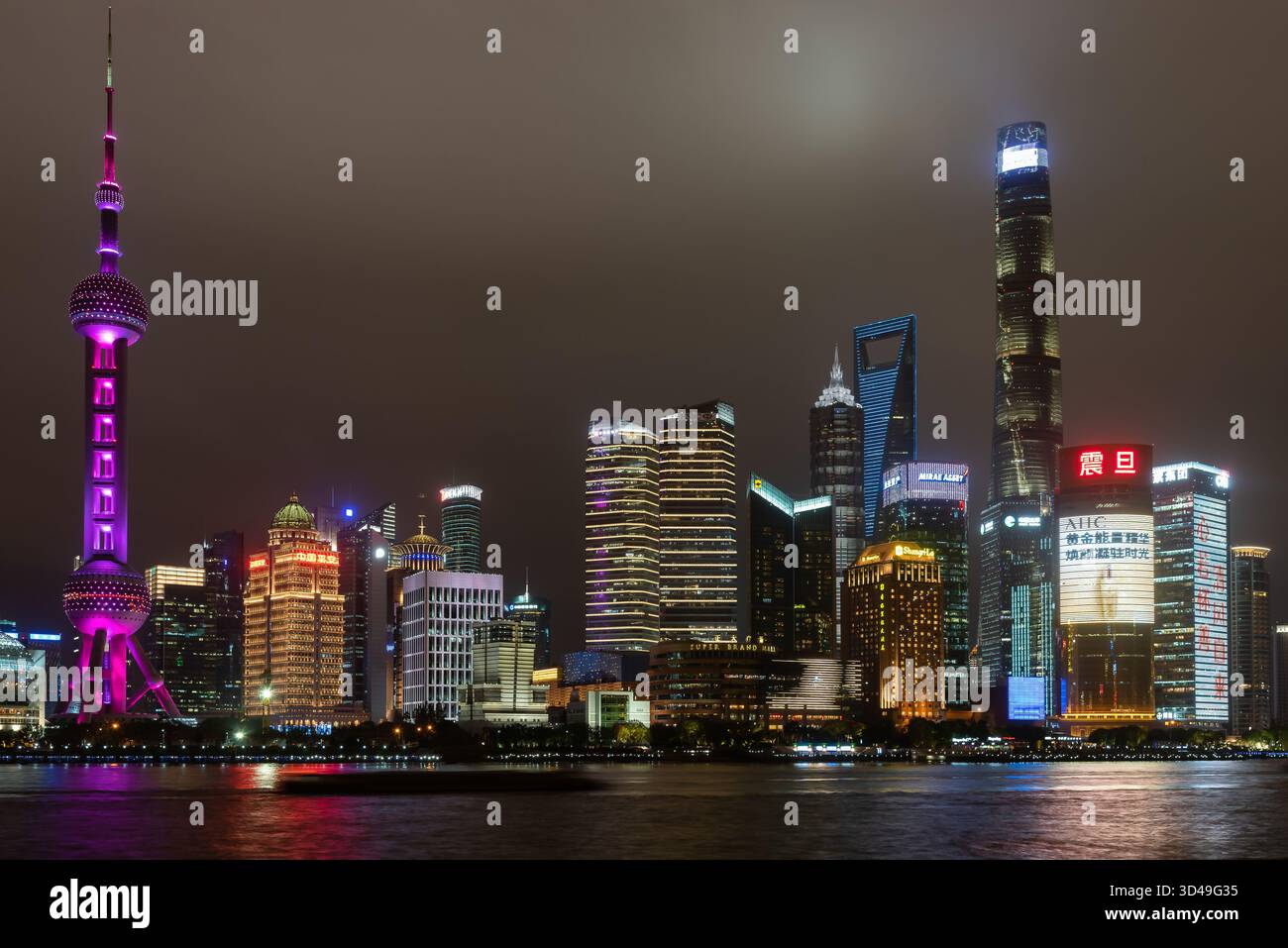 The breathtaking modern skyline of Shanghai, China, glows with a ...