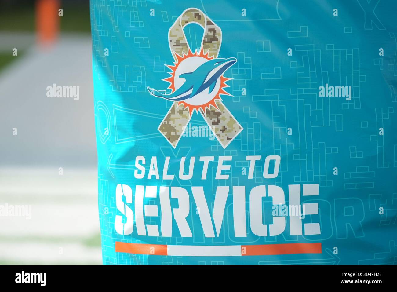 A Salute To Service sign is seen before an NFL football game between ...