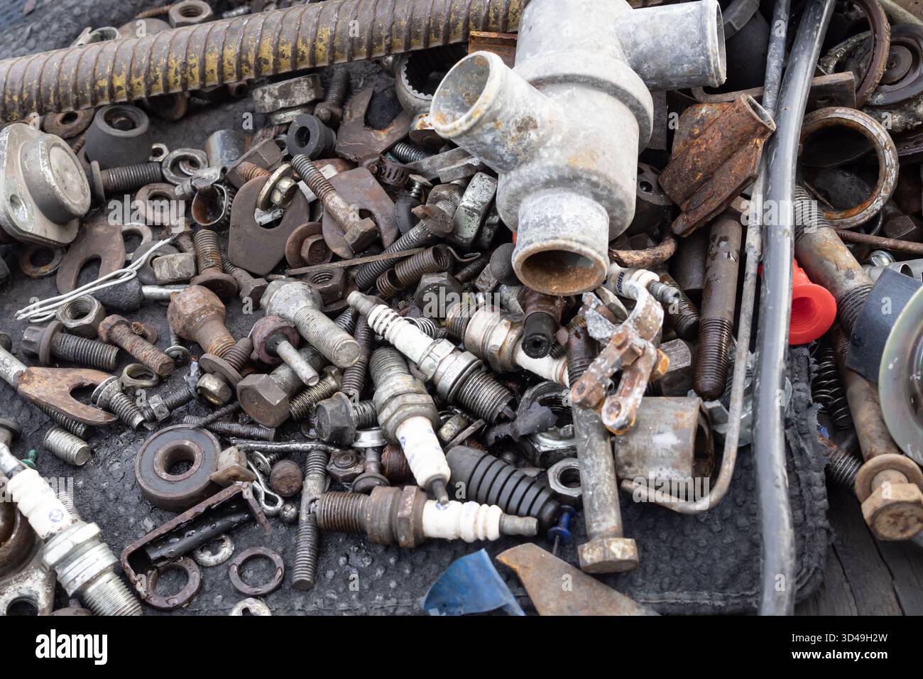 Industrial scrap pile with rusty bolts, wires and cables. Texture of ...