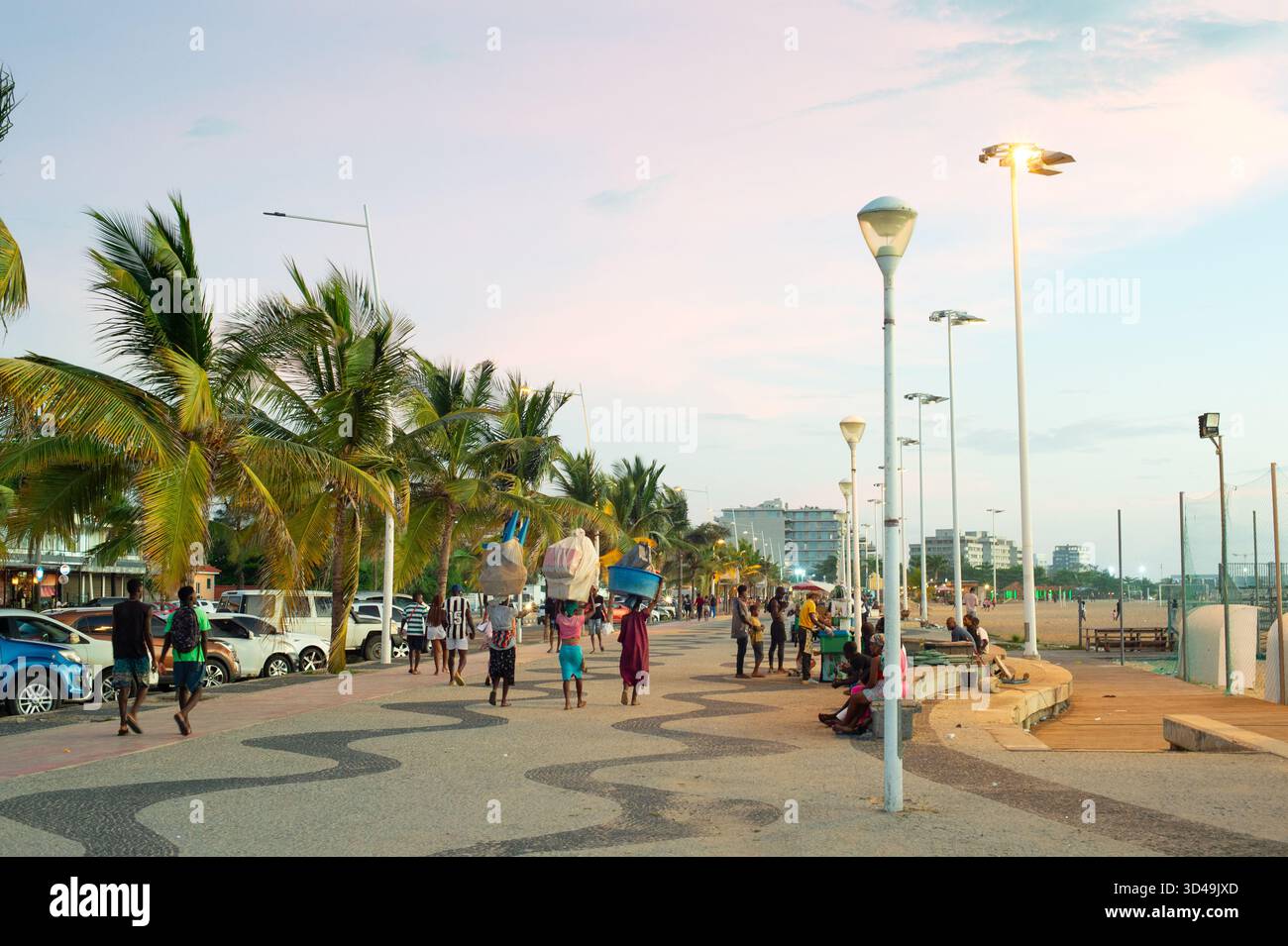 LUANDA, ANGOLA - APRIL 18, 2025: People at the promenade on Ilha de ...