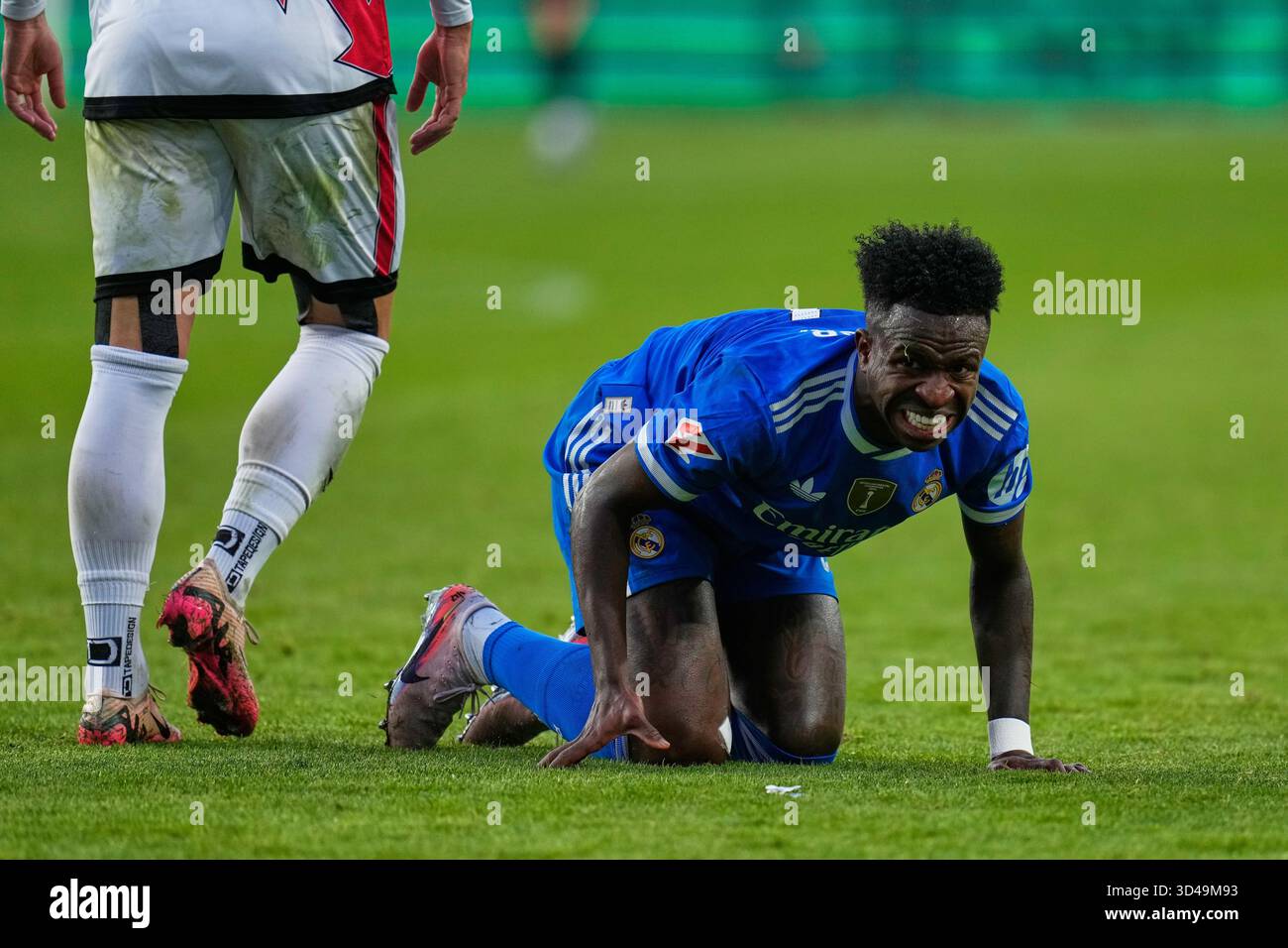 Real Madrid's Vinicius Junior reacts after a fall during a Spanish La Liga soccer match between ...