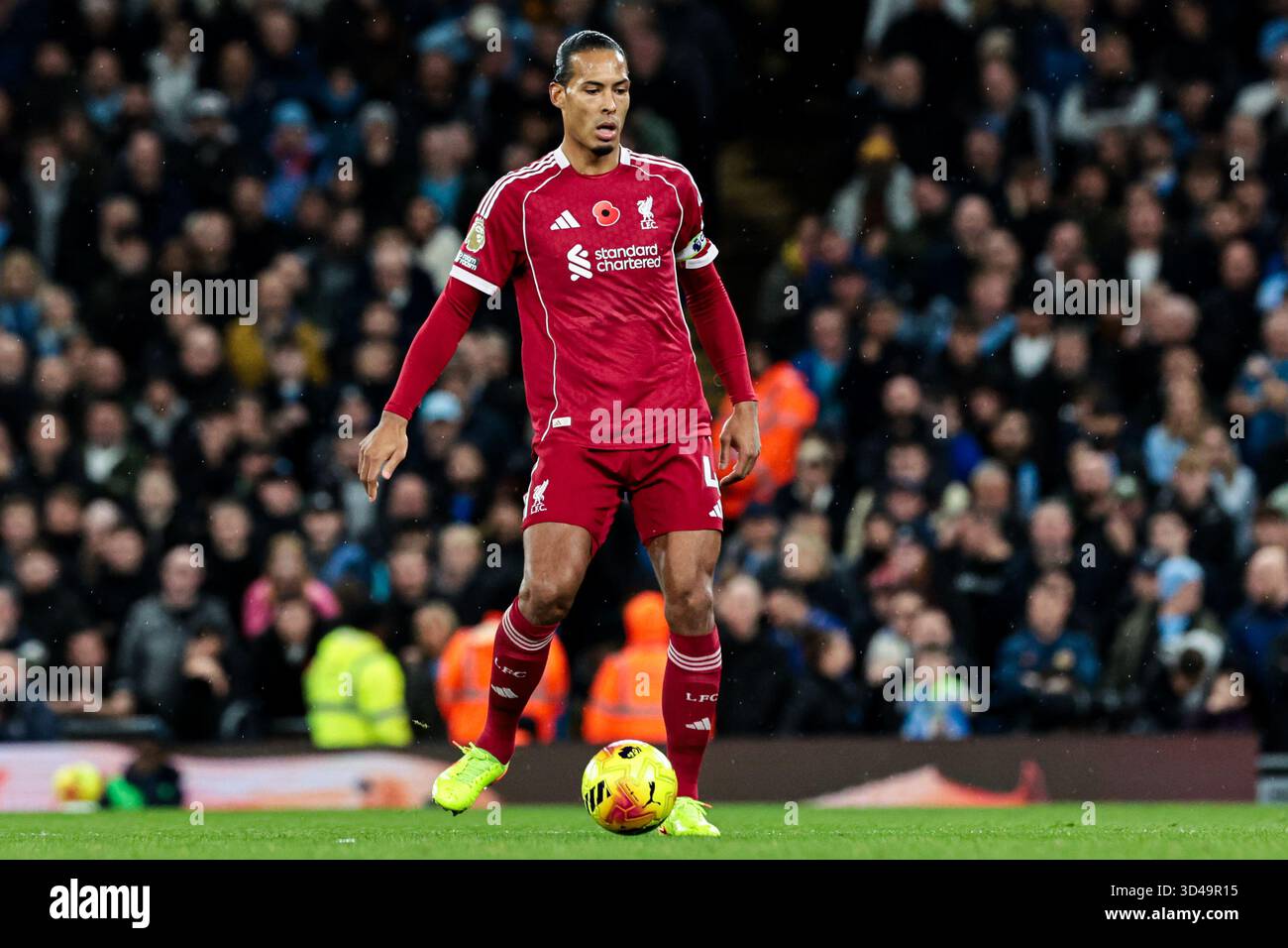 Virgil van Dijk of Liverpool passes the ball forward during the Premier ...