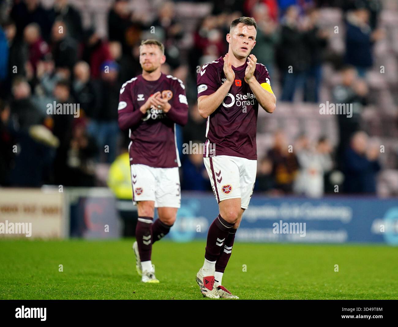 Heart of Midlothian's Lawrence Shankland (right) applauds the fans after the final whistle of ...