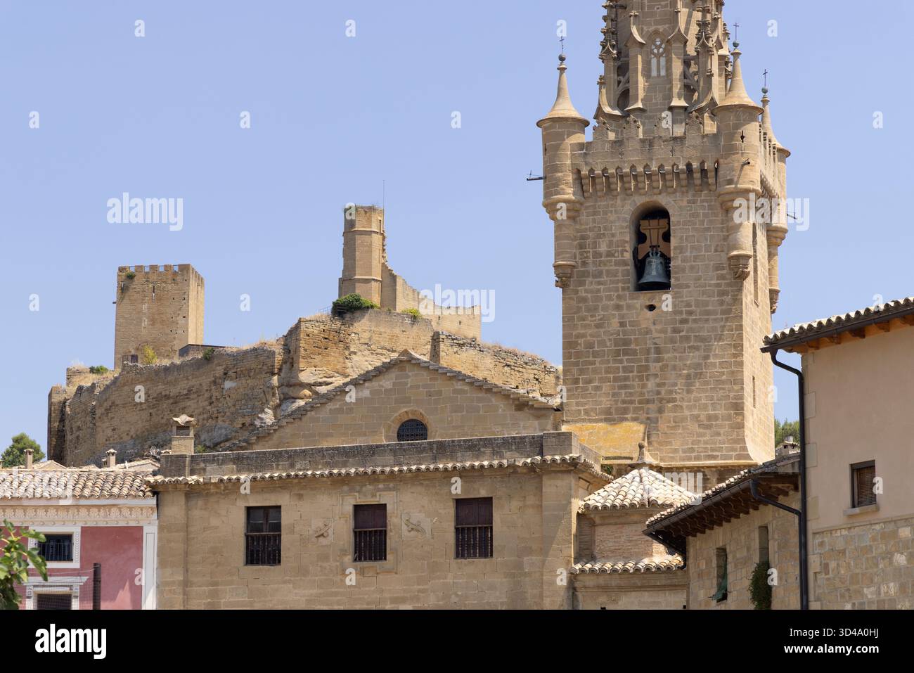 Historic stone castle ruins and church bell tower rising above ...