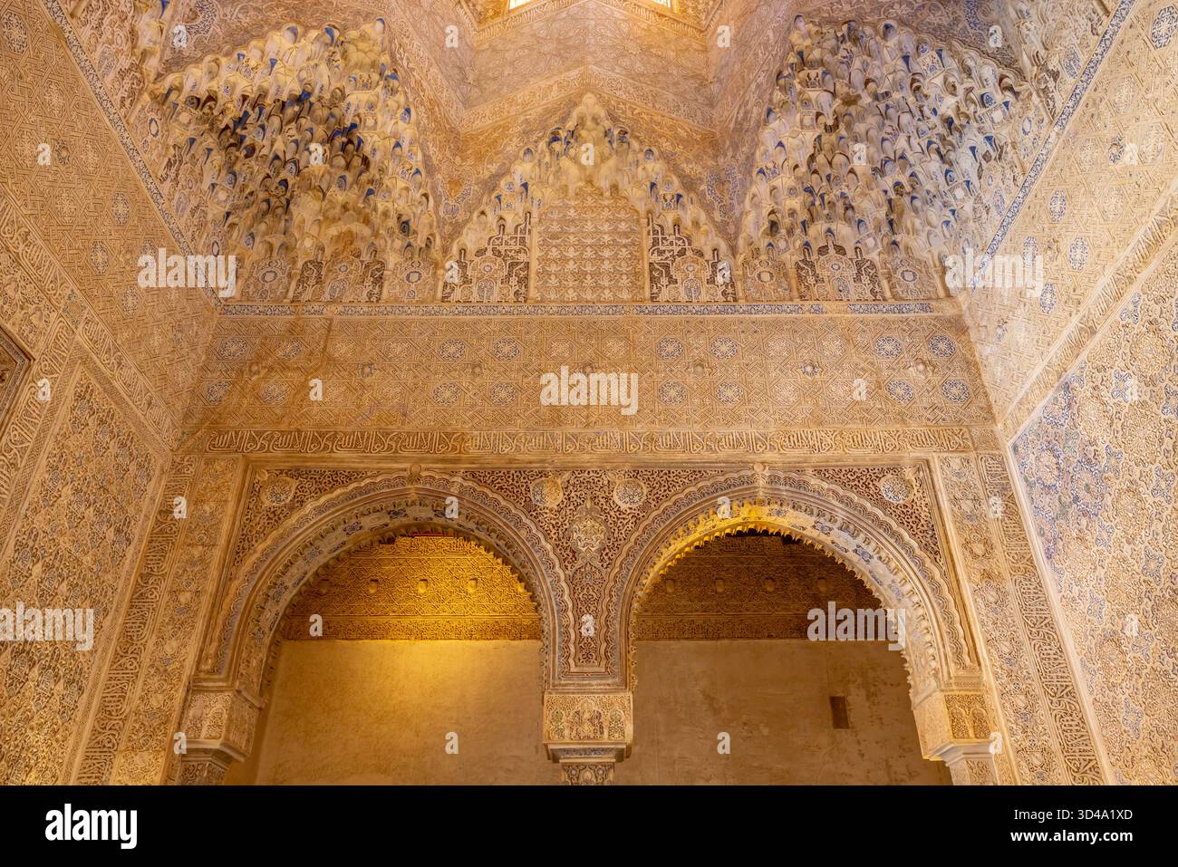 Ornate muqarnas and calligraphic patterns adorning walls and arches ...