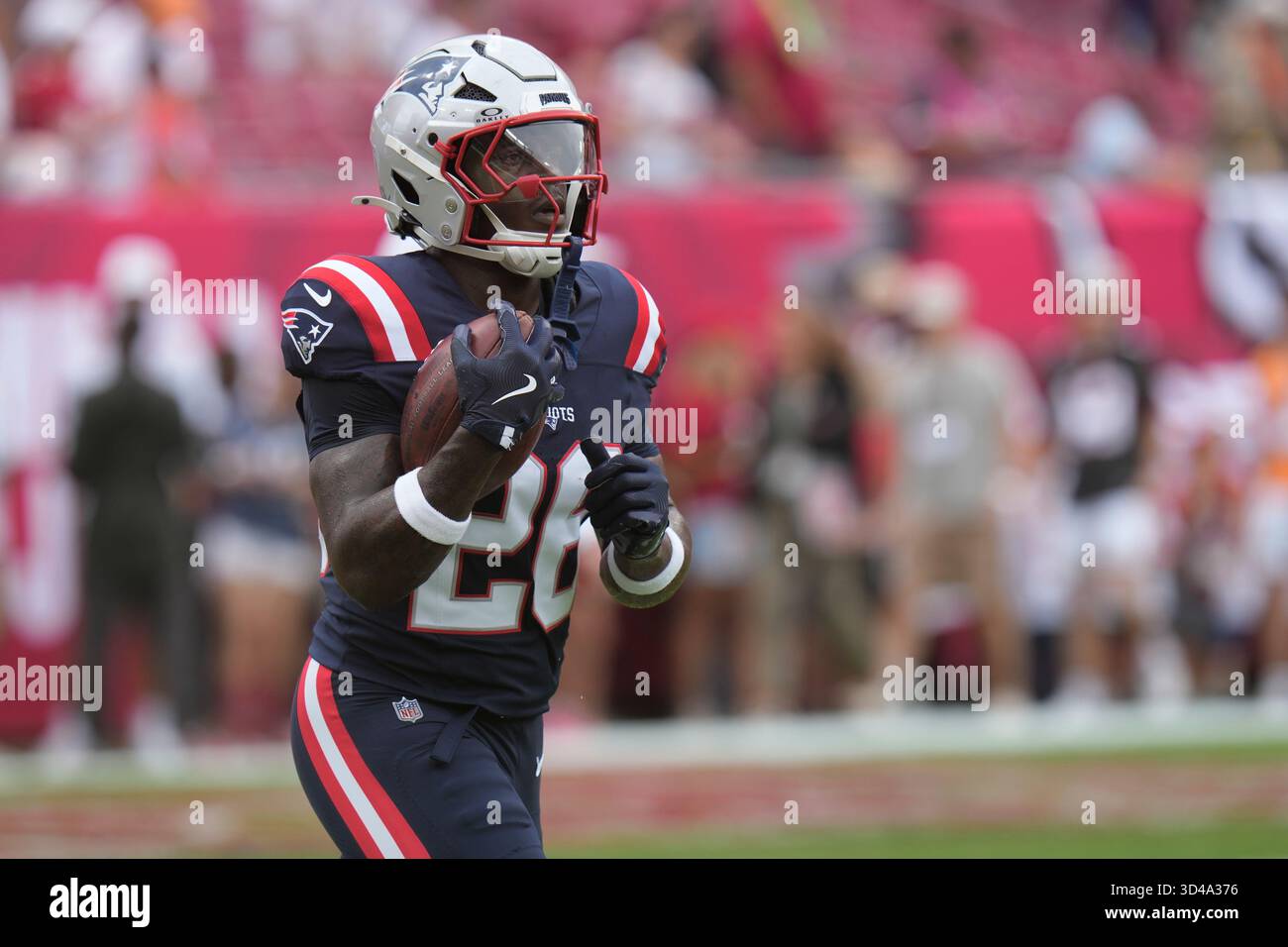 New England Patriots running back Terrell Jennings (26) warms up before ...