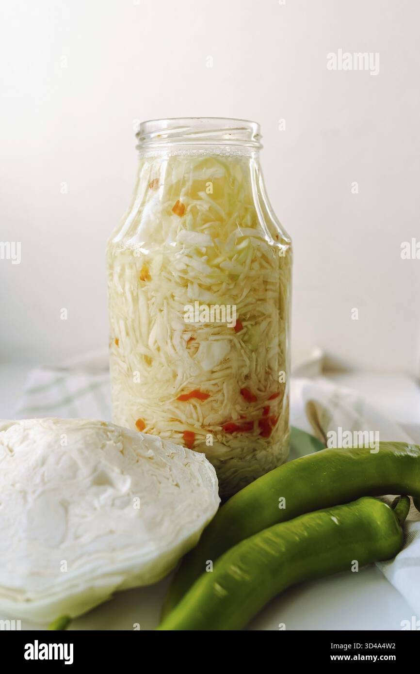 Homemade fermented cabbage with spices, hot chili pepper, in a glass ...