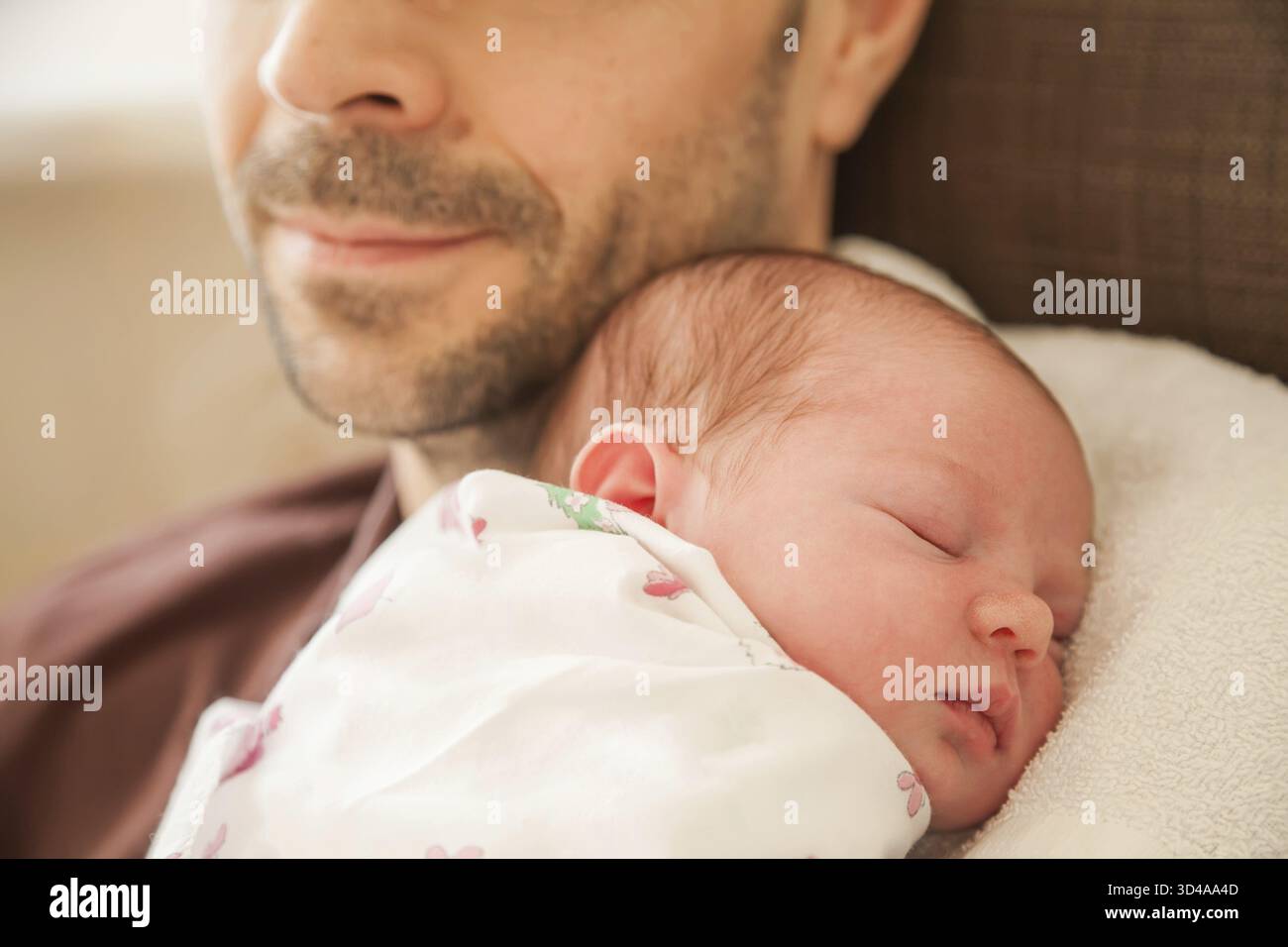 Close-up newborn baby girl sleeping on her father's chest Stock Photo ...