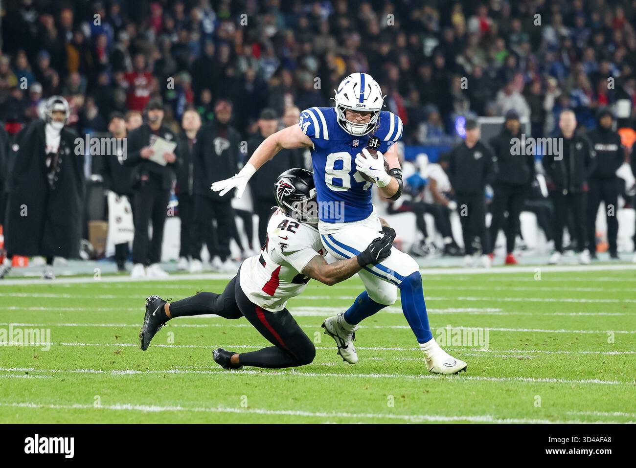Tyler Warren (Indianapolis Colts, #84) with Josh Woods (Atlanta Falcons ...