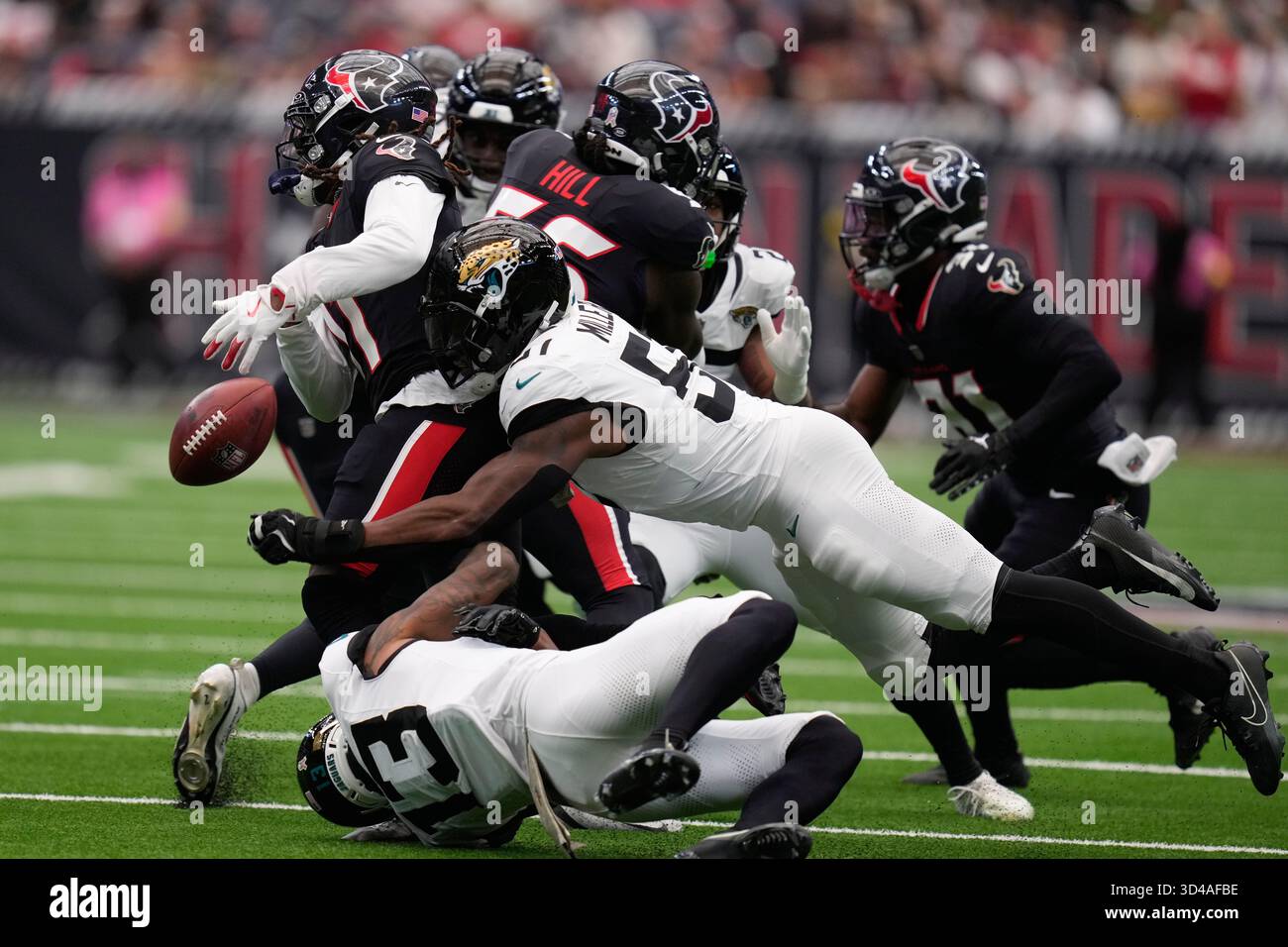 Houston Texans cornerback Tremon Smith (11) fumbles during an NFL ...