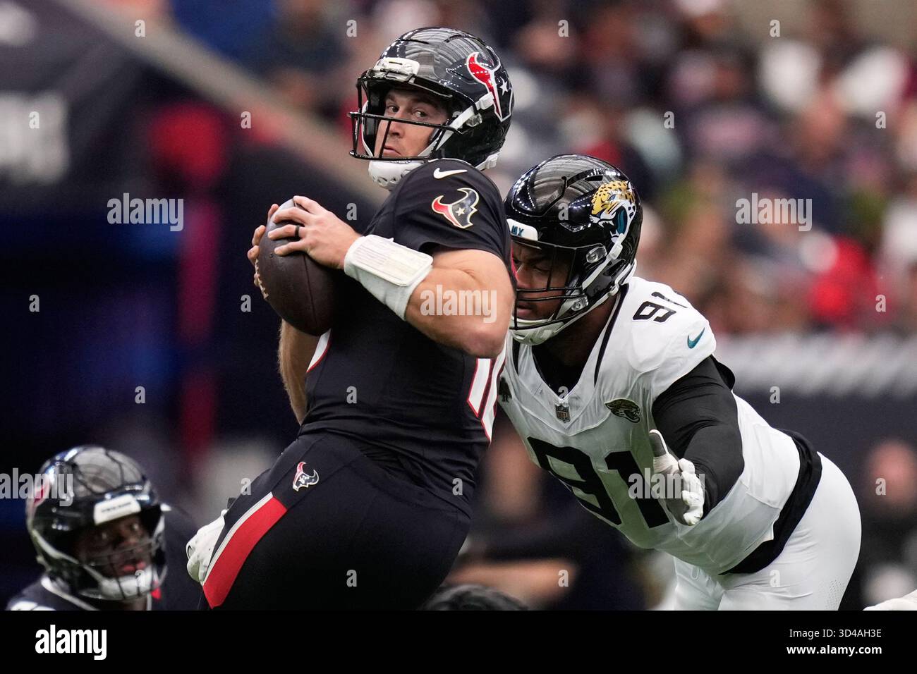 Houston Texans quarterback Davis Mills (10) avoids the sack against ...