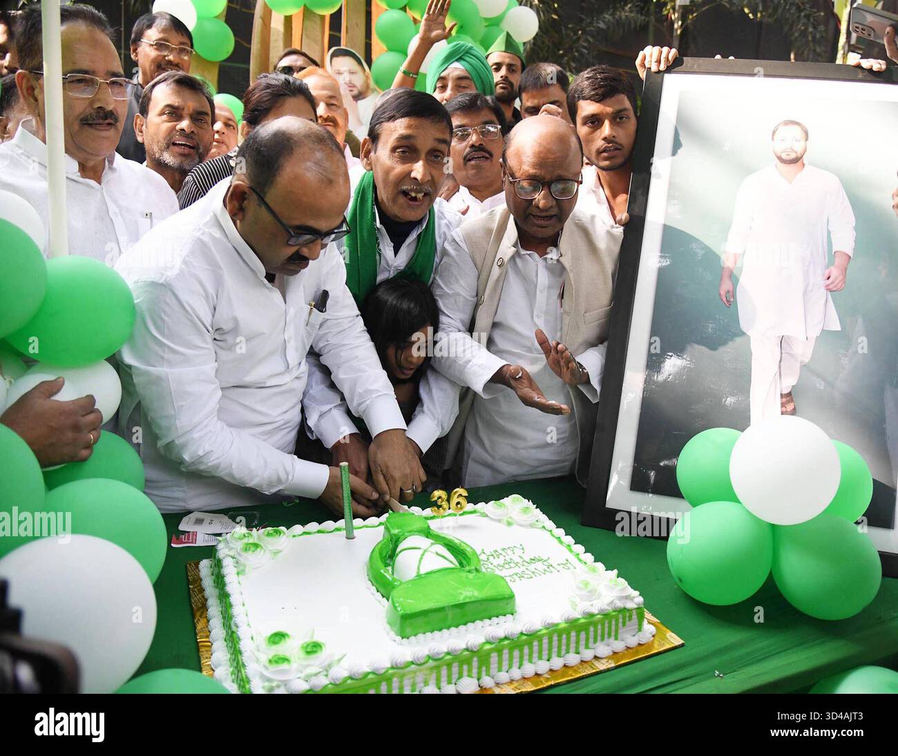 PATNA, INDIA - NOVEMBER 9: RJD leaders cutting the cake to celebrating ...