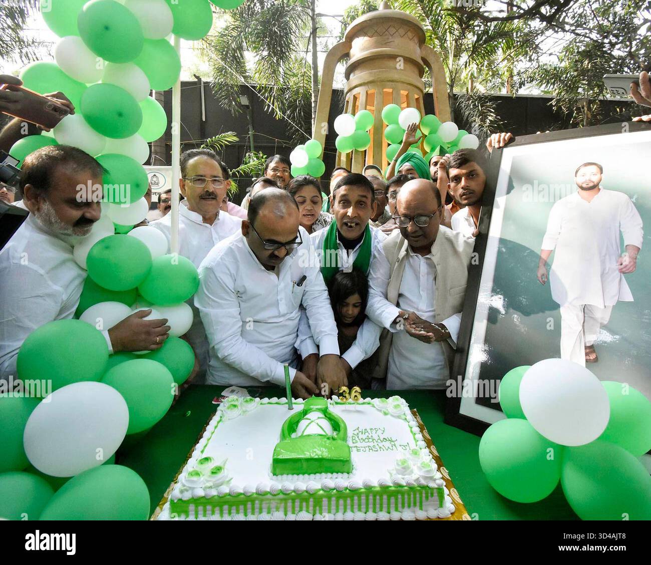 PATNA, INDIA - NOVEMBER 9: RJD leaders cutting the cake to celebrating ...