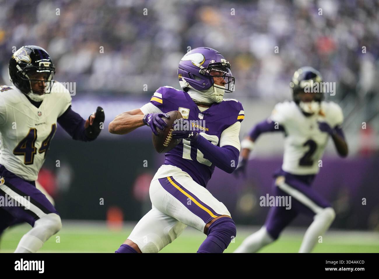 Minnesota Vikings wide receiver Justin Jefferson (18) carries ahead of ...