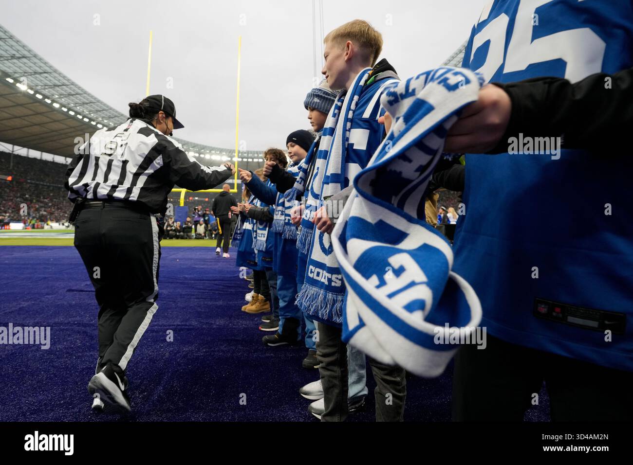 Field judge Karina Tovar (91) greets fans before an NFL football game ...