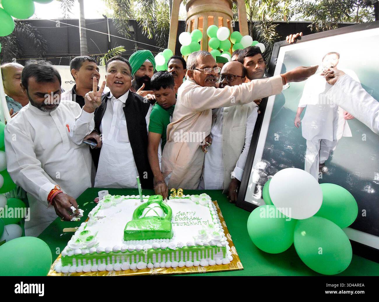 PATNA, INDIA - NOVEMBER 9: RJD leaders cutting the cake to celebrating ...