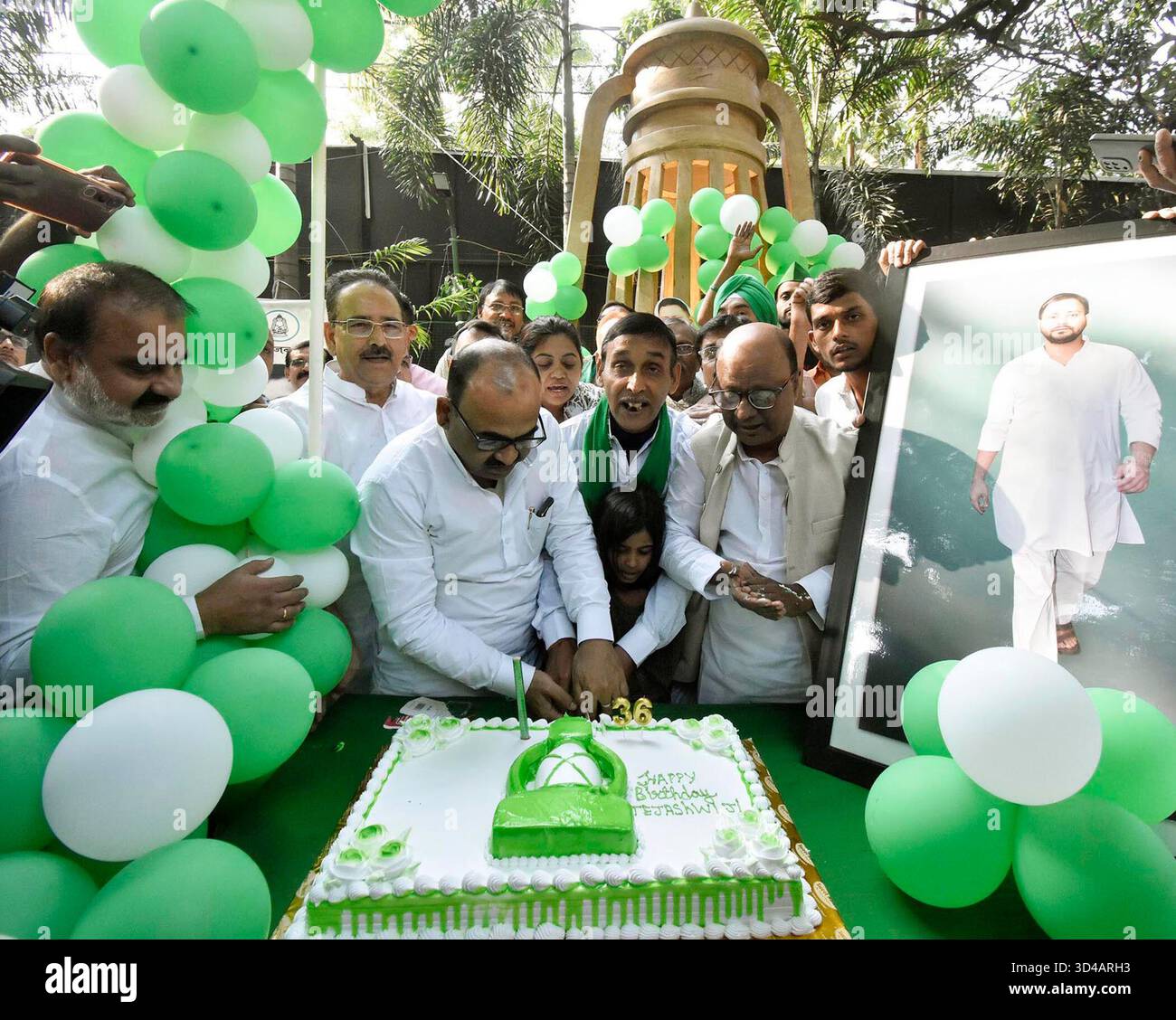 PATNA, INDIA - NOVEMBER 9: RJD leaders cutting the cake to celebrating ...