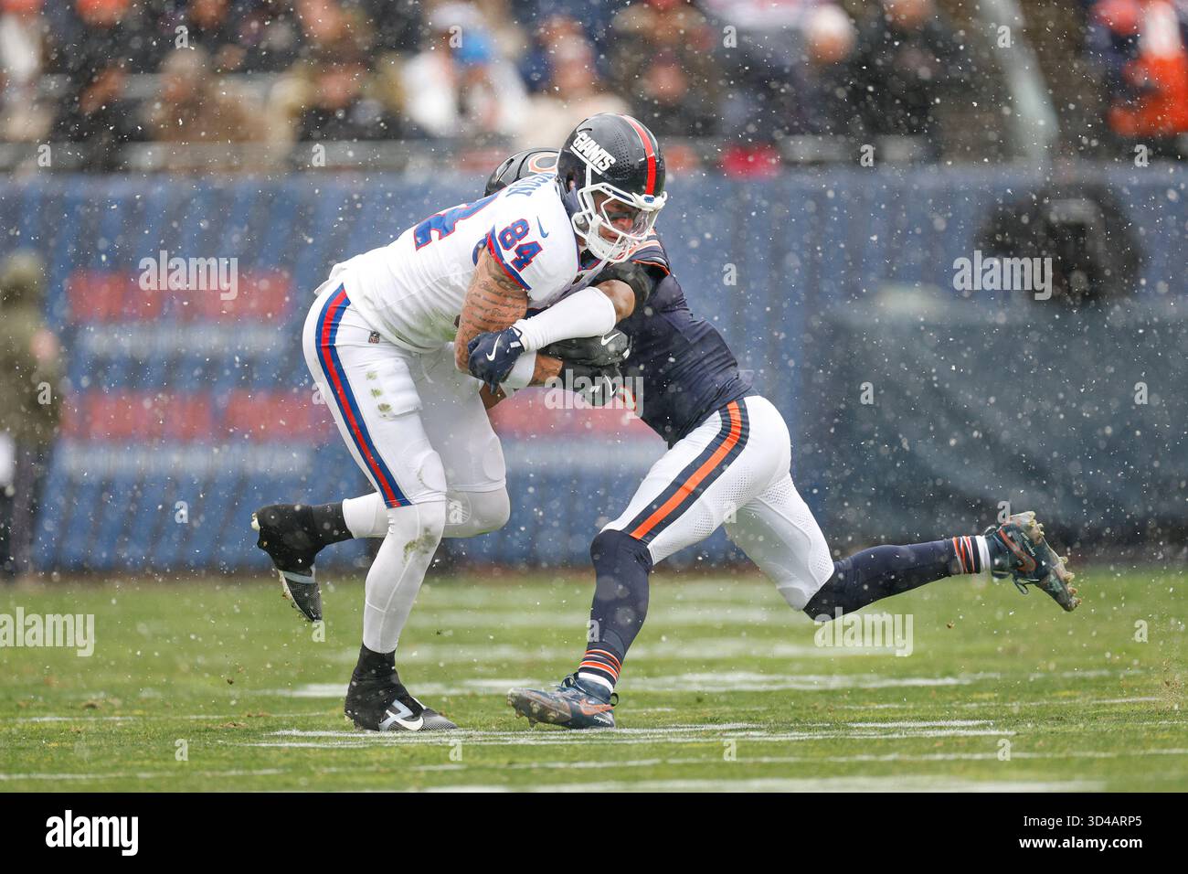 Chicago Bears safety Jaquan Brisker (9) tackles New York Giants tight ...