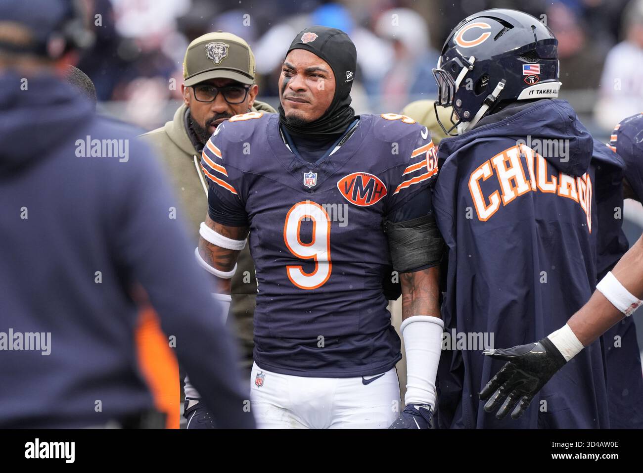 Chicago Bears safety Jaquan Brisker reacts after being injured on a ...