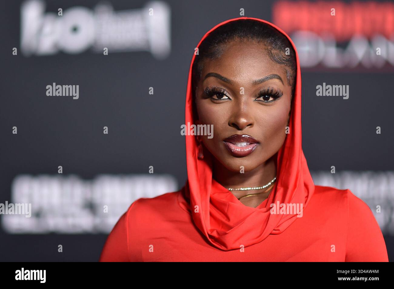 Loren Lott arrives at the premiere of "Predator: Badlands" on Monday ...