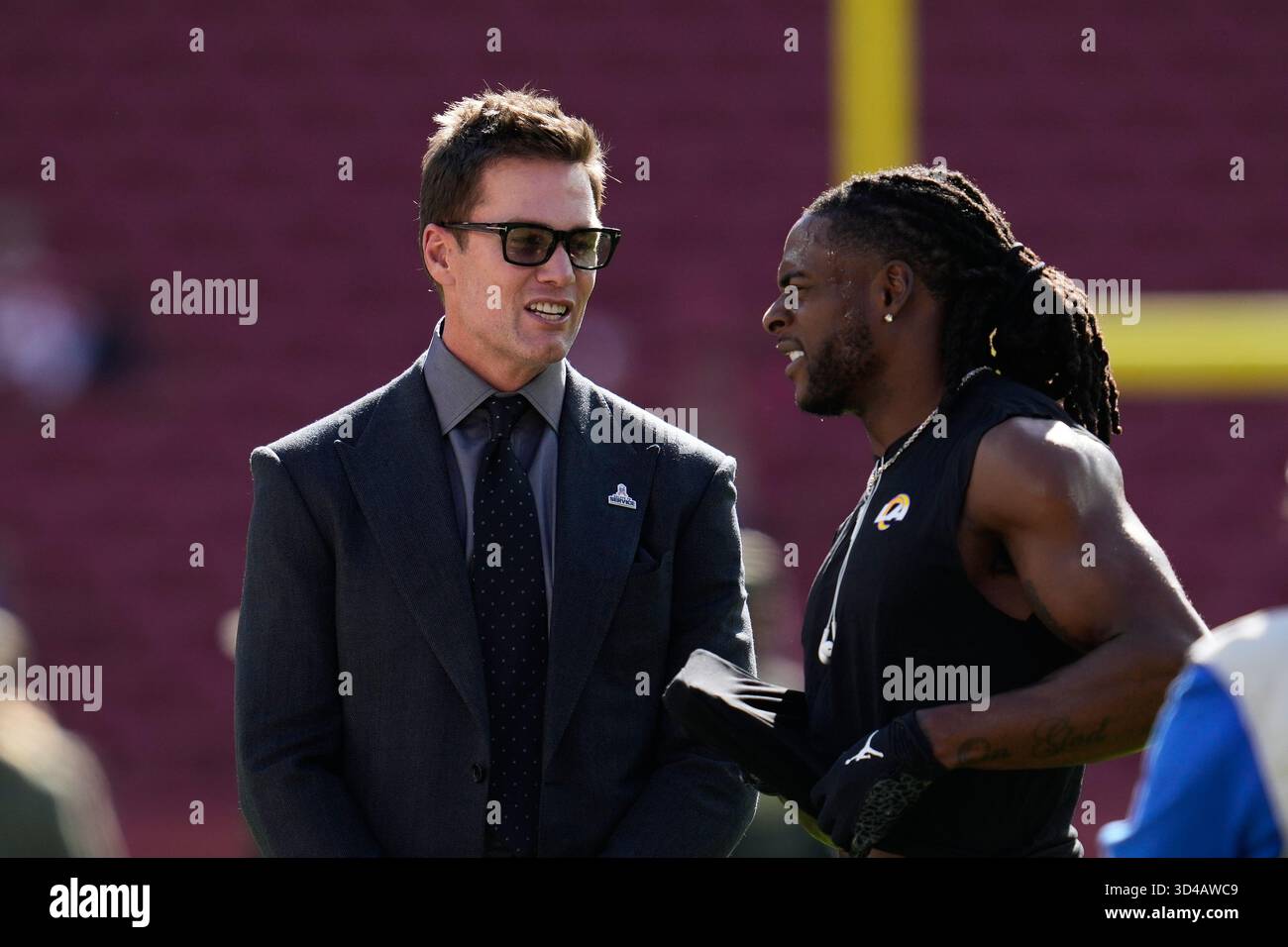Tom Brady, left, talks with Los Angeles Rams wide receiver Davante ...