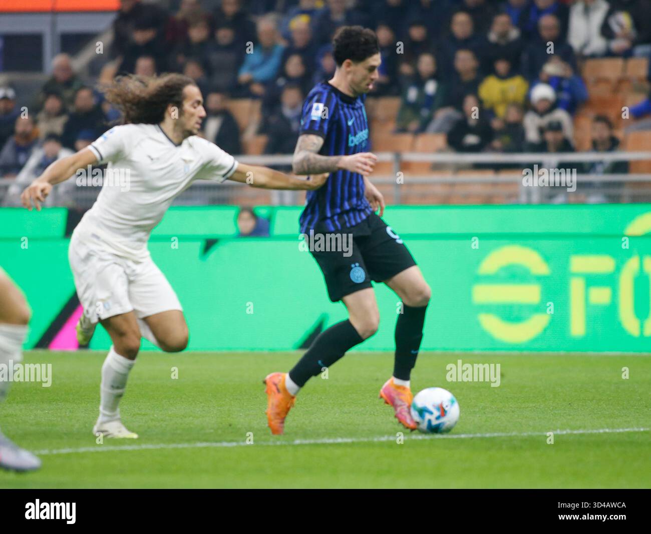 Alessandro Bastoni of FC Inter and Matteo Guendouzi of SS Lazio seen in action during the ...