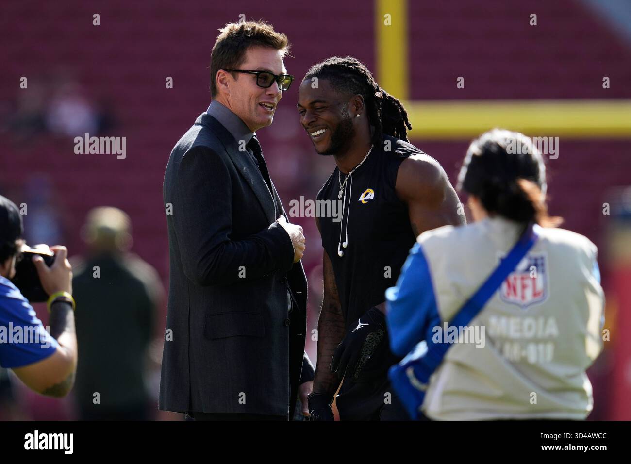 Tom Brady, left, talks with Los Angeles Rams wide receiver Davante ...