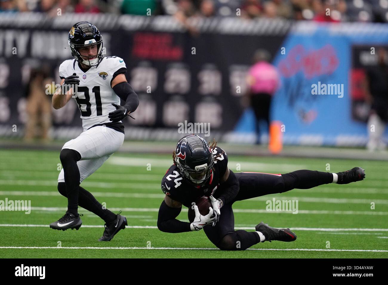 Houston Texans cornerback Derek Stingley Jr. (24) intercepts the ball ...