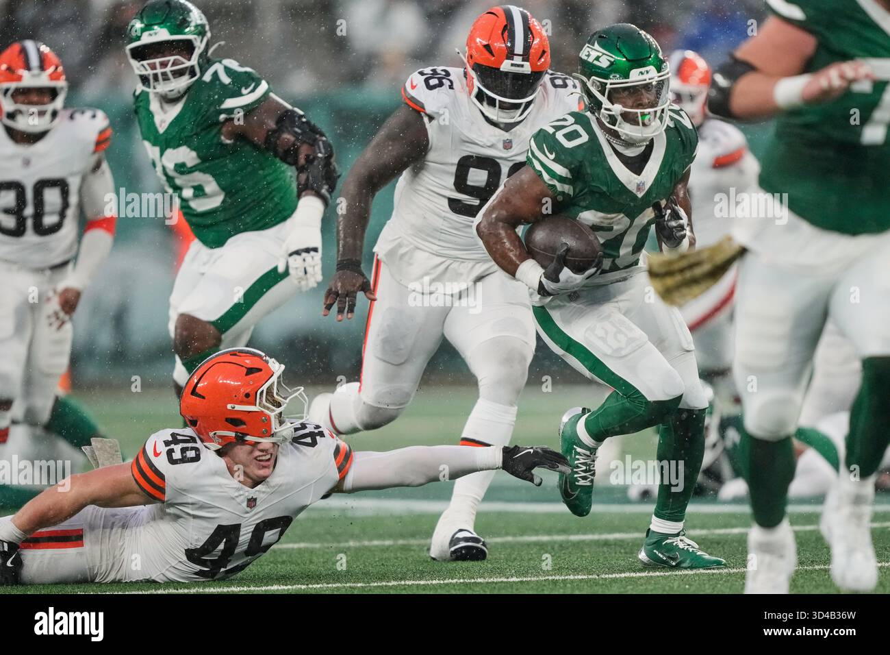 New York Jets running back Breece Hall heads past Cleveland Browns ...