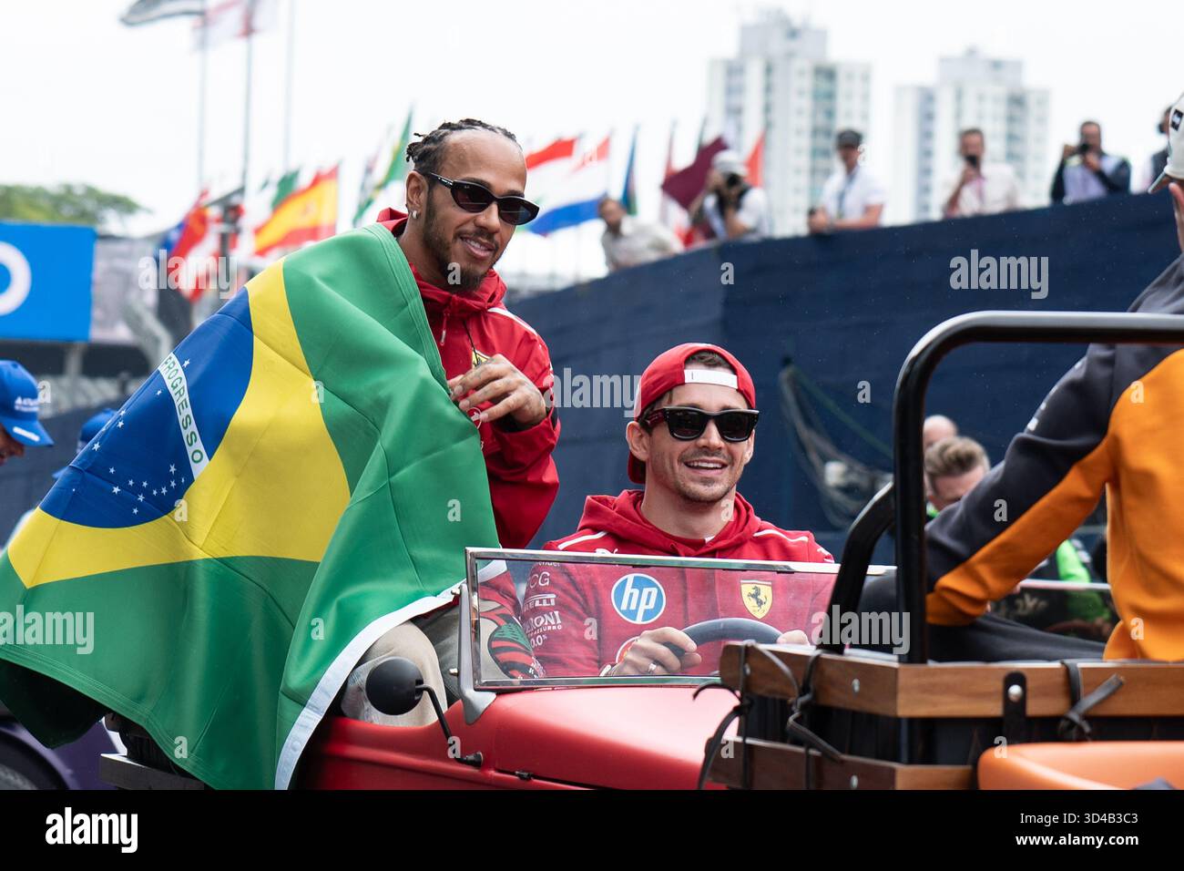 Lewis Hamilton of Ferrari and Charles Leclerc of Ferrari prior to the ...