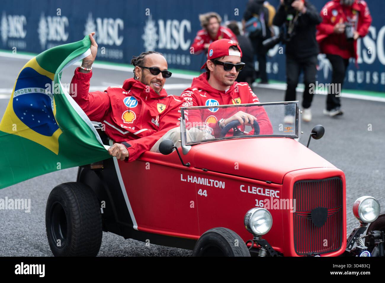 Lewis Hamilton of Ferrari and Charles Leclerc of Ferrari prior to the ...