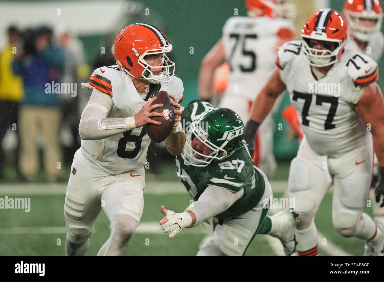 Cleveland Browns quarterback Dillon Gabriel (8) runs past a diving New ...