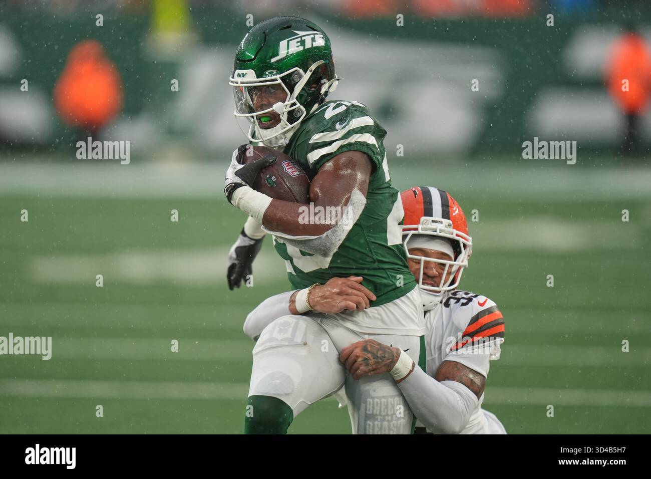 Cleveland Browns safety Ronnie Hickman, right, tackles New York Jets ...