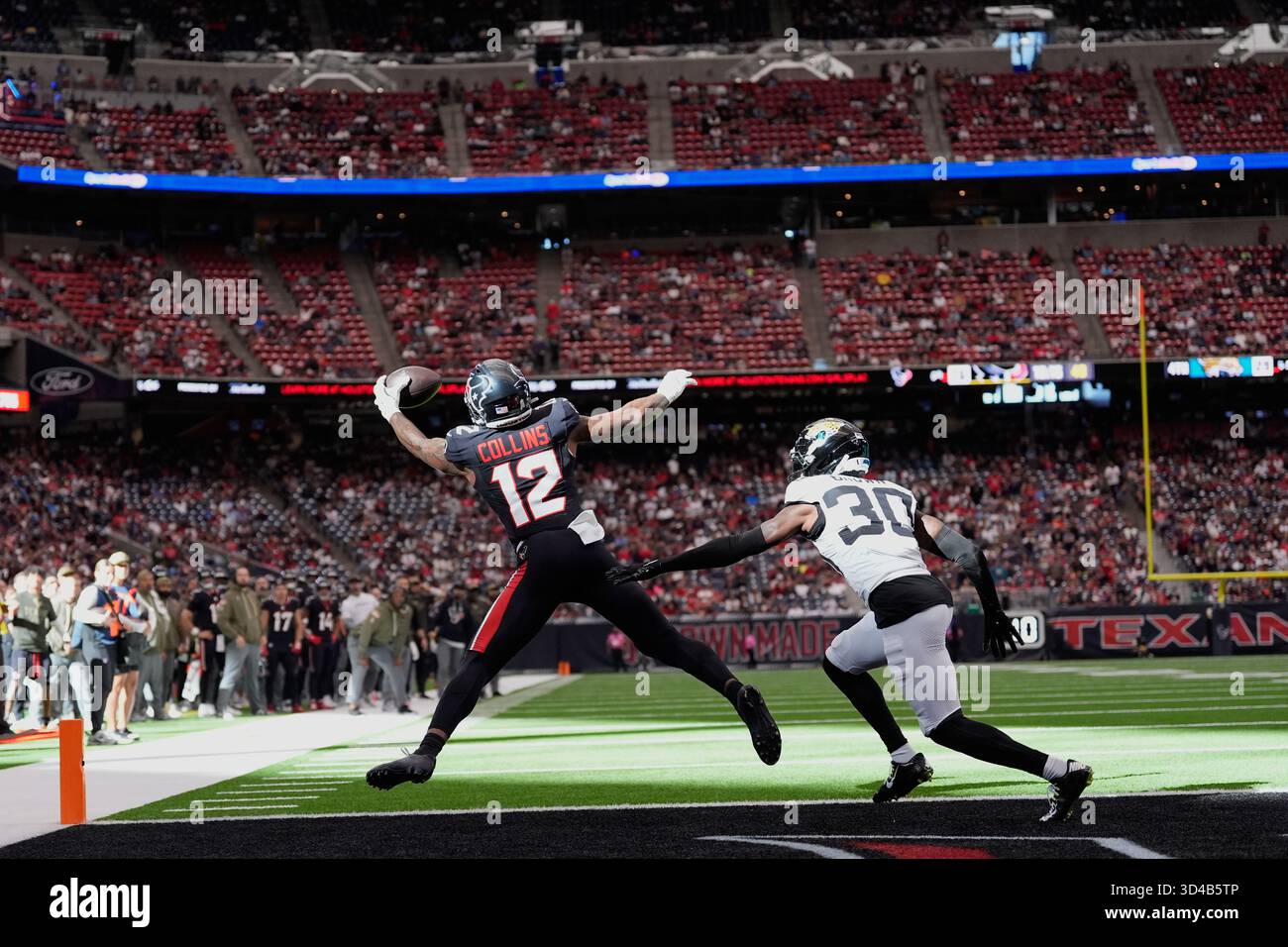 Houston Texans wide receiver Nico Collins (12) scores a two point ...