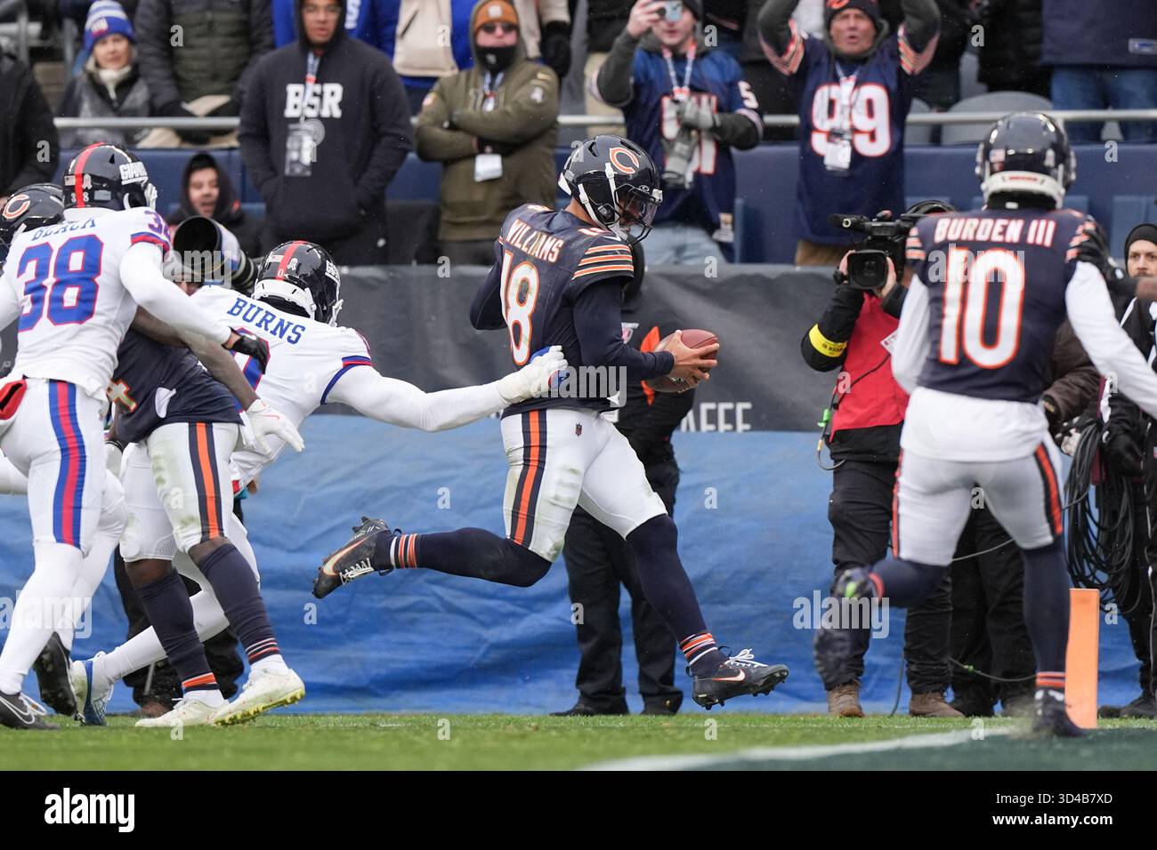 Chicago Bears quarterback Caleb Williams (18) scores a touchdown during ...