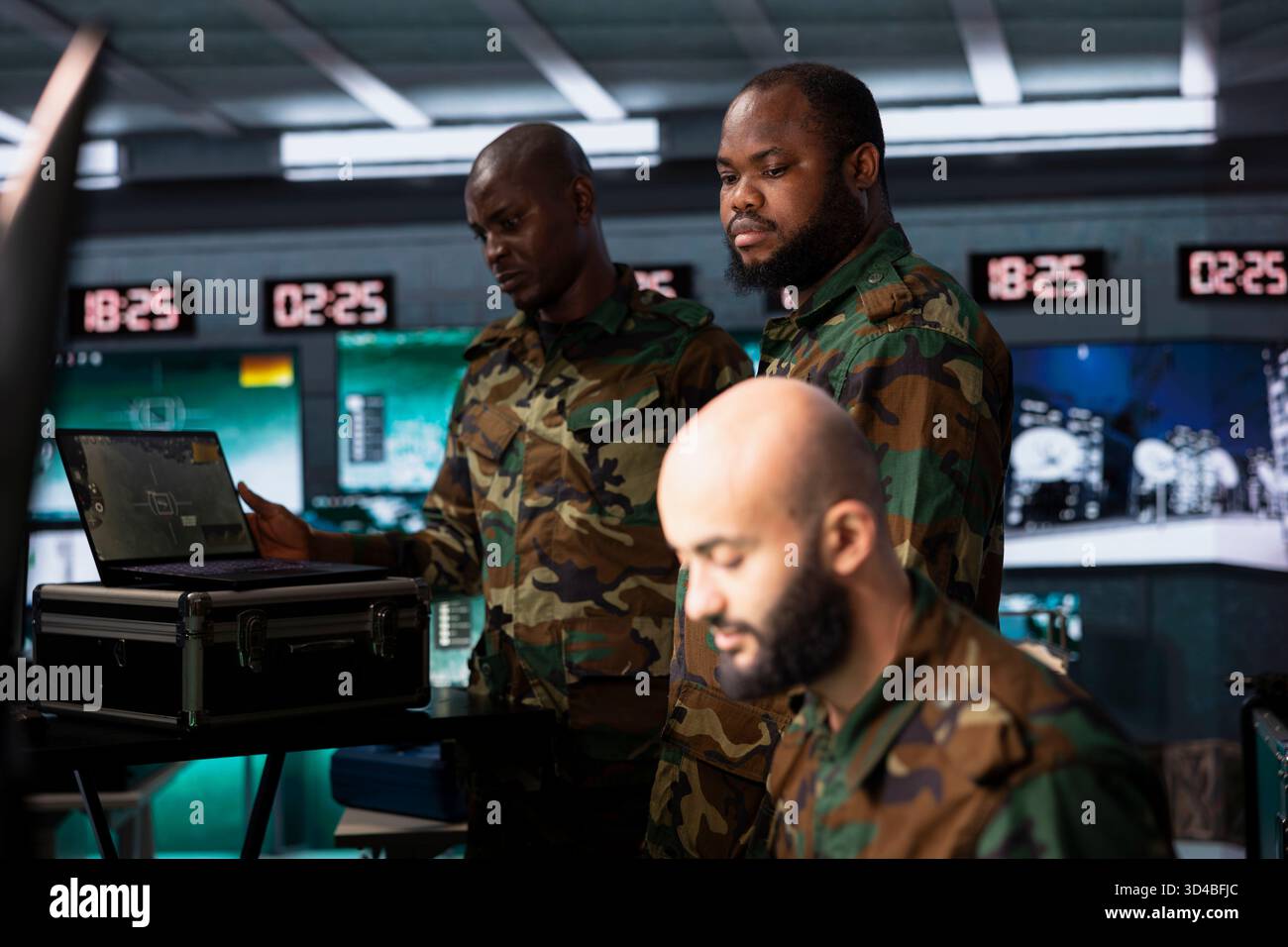 Military agents in war room operating satellite system to support ...