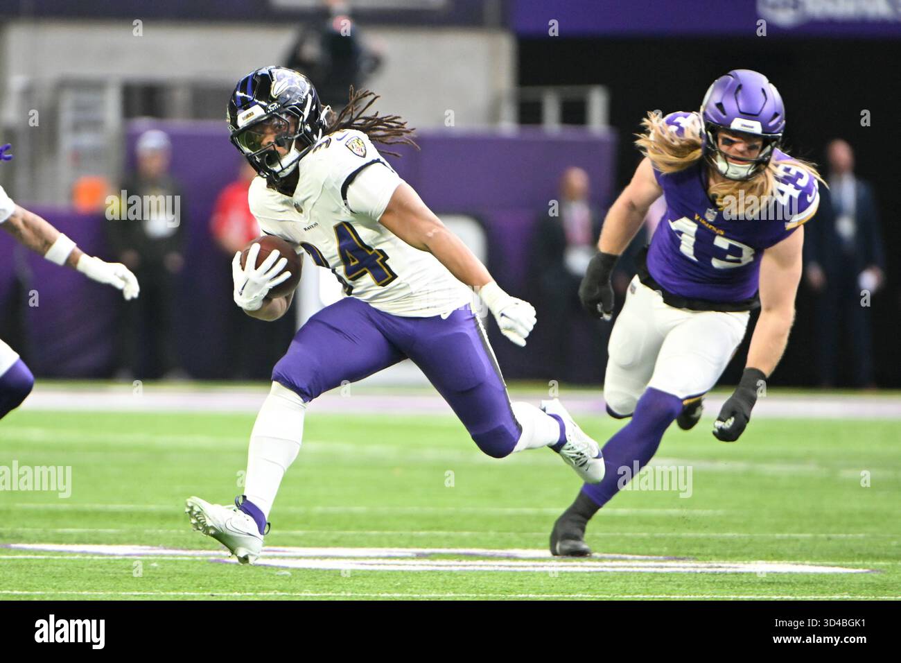 Baltimore Ravens running back Keaton Mitchell runs past Minnesota ...