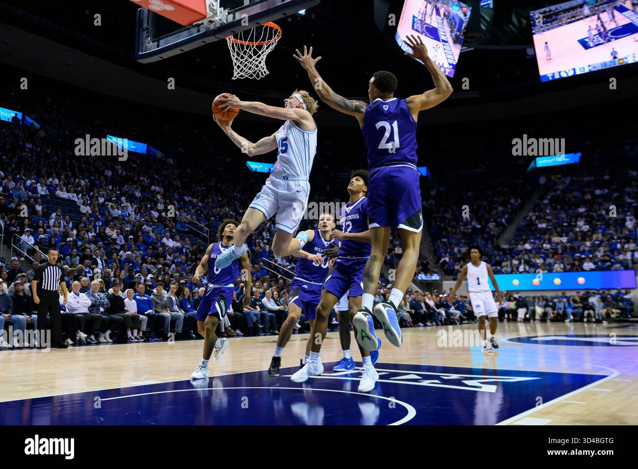BYU guard Richie Saunders (15) drives to the basket past the defense of ...
