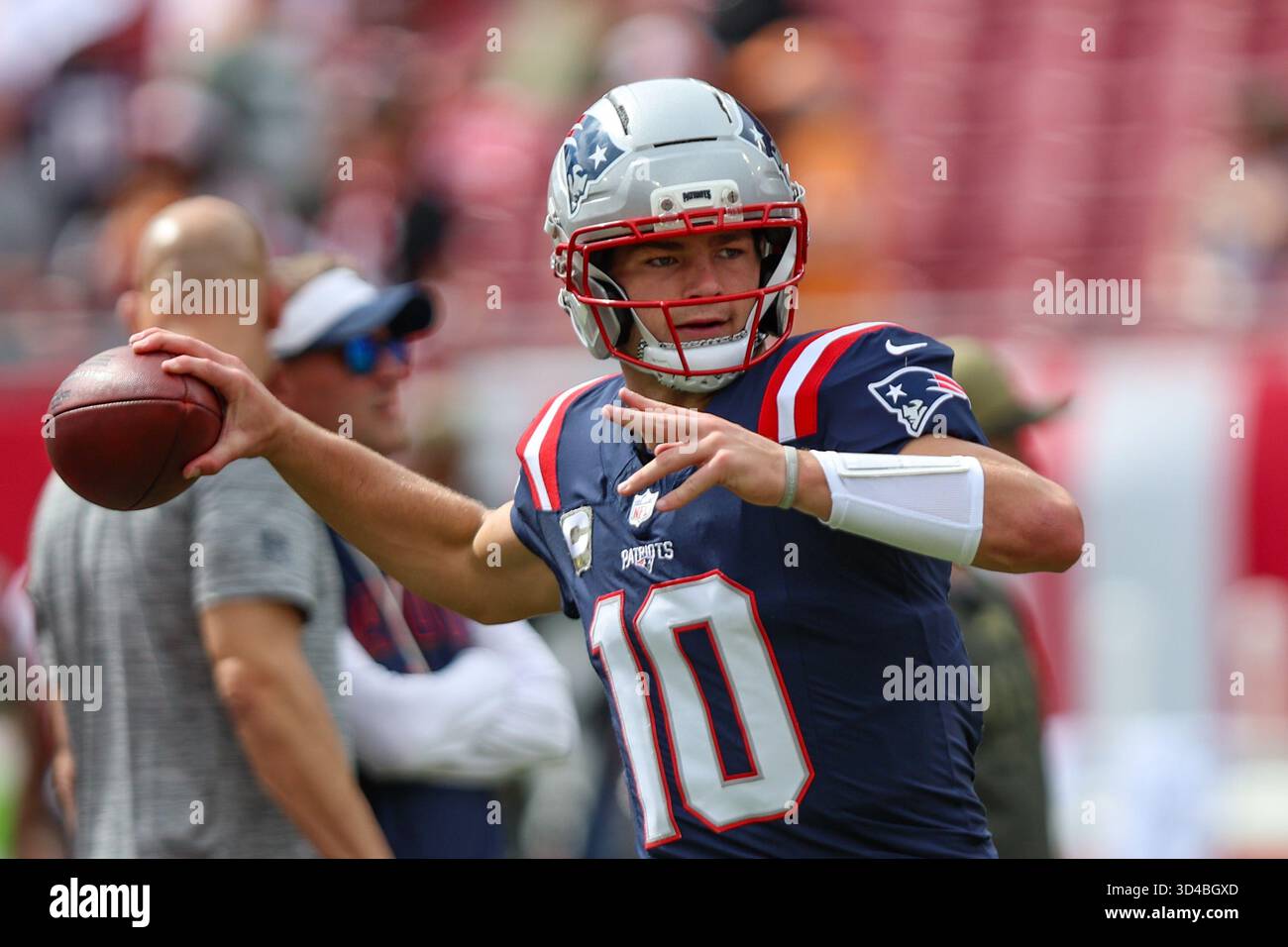 New England Patriots quarterback Drake Maye (10) warms up before an NFL ...