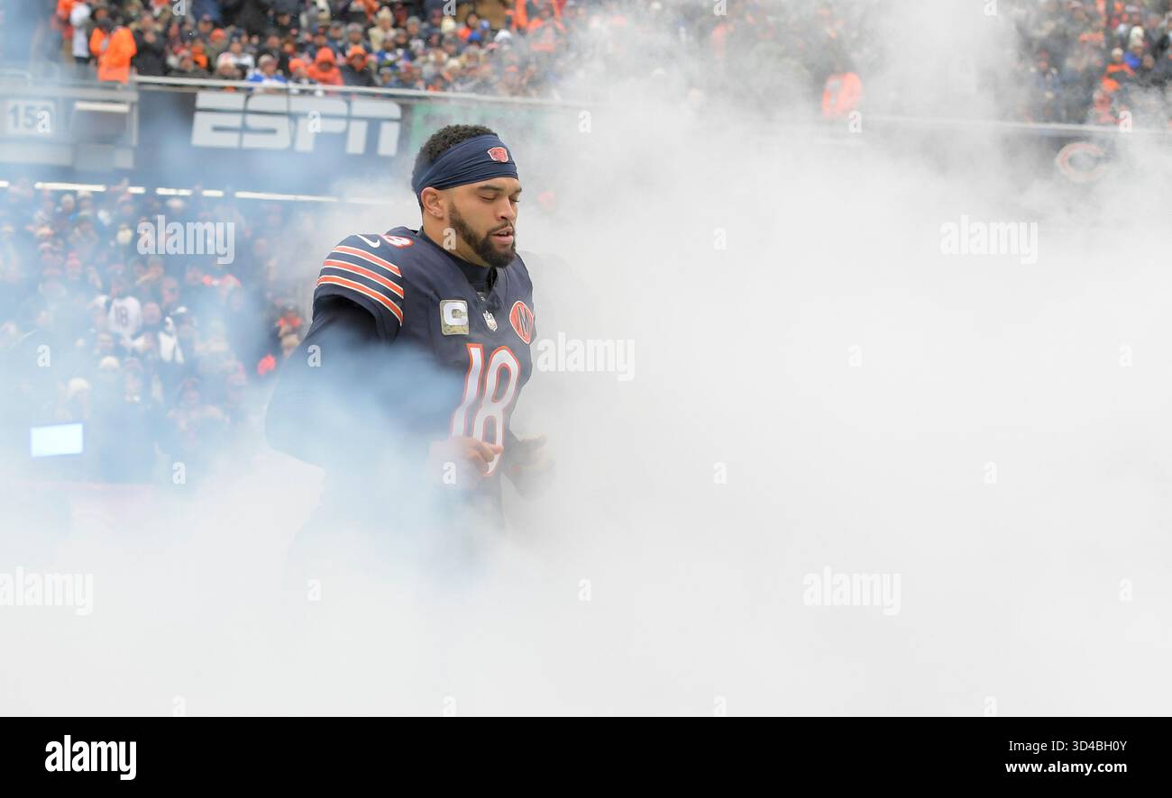 Chicago Bears quarterback Caleb Williams (18) takes the field through a ...