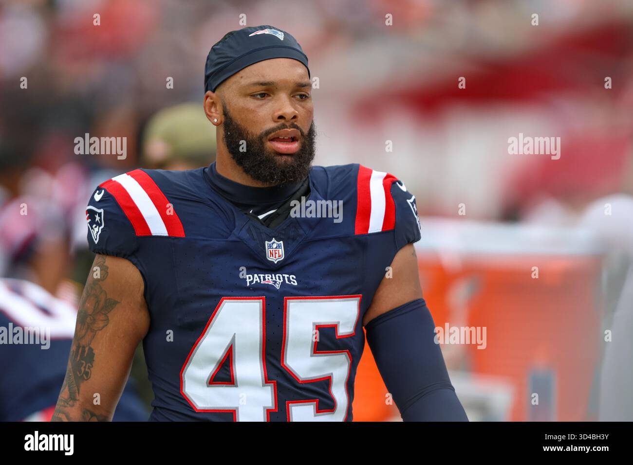 New England Patriots linebacker Caleb Murphy (45) walks the sideline during an NFL football game ...