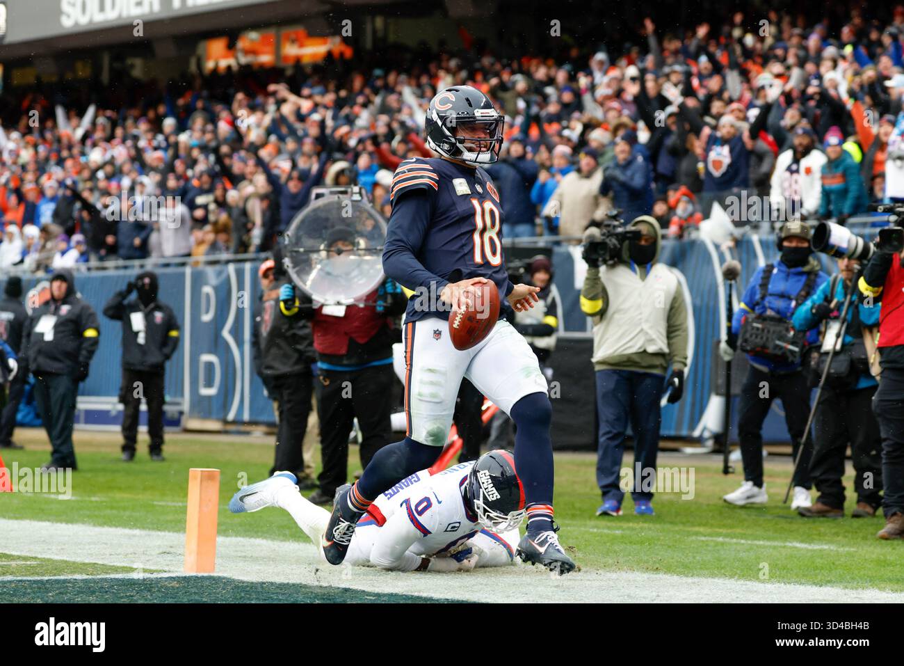Chicago Bears quarterback Caleb Williams (18) scores a touchdown ...