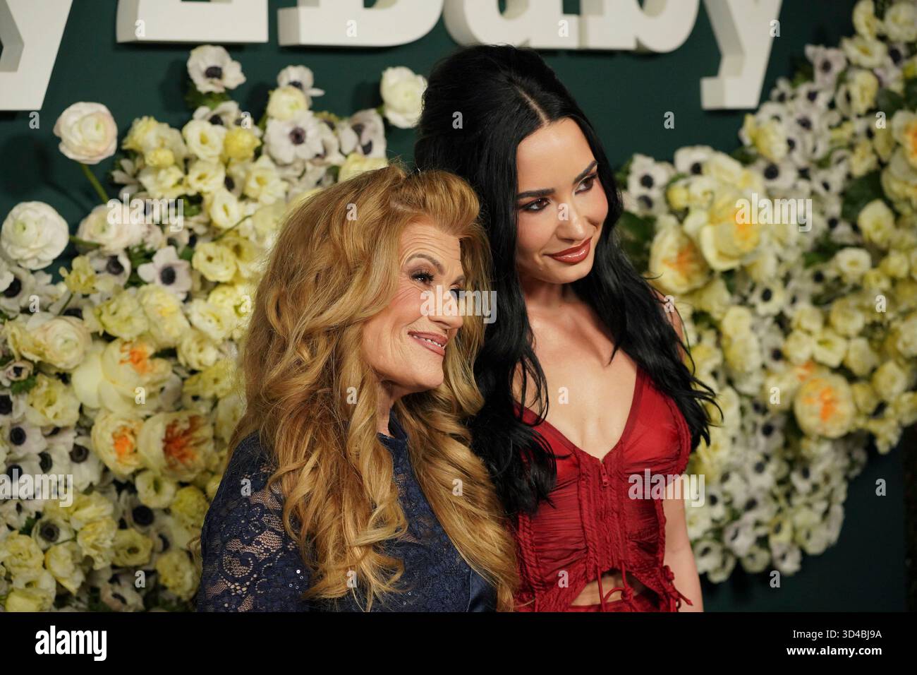 Demi Lovato, right, and her mom Dianna De La Garza arrive at the 2025 ...