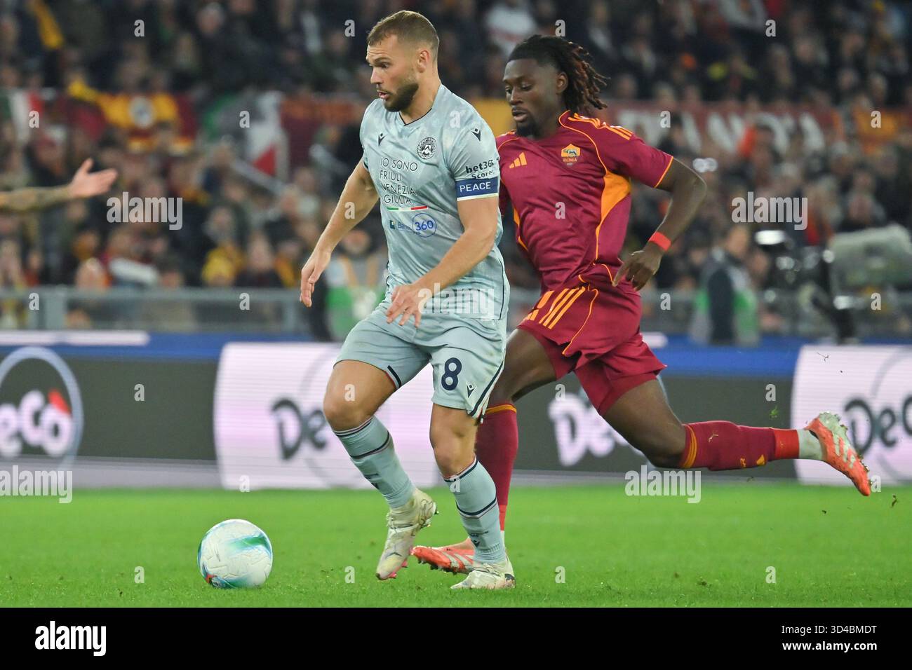 Jesper Karlstrom of Udinese,Manu Kone of AS Roma during the serie A ...