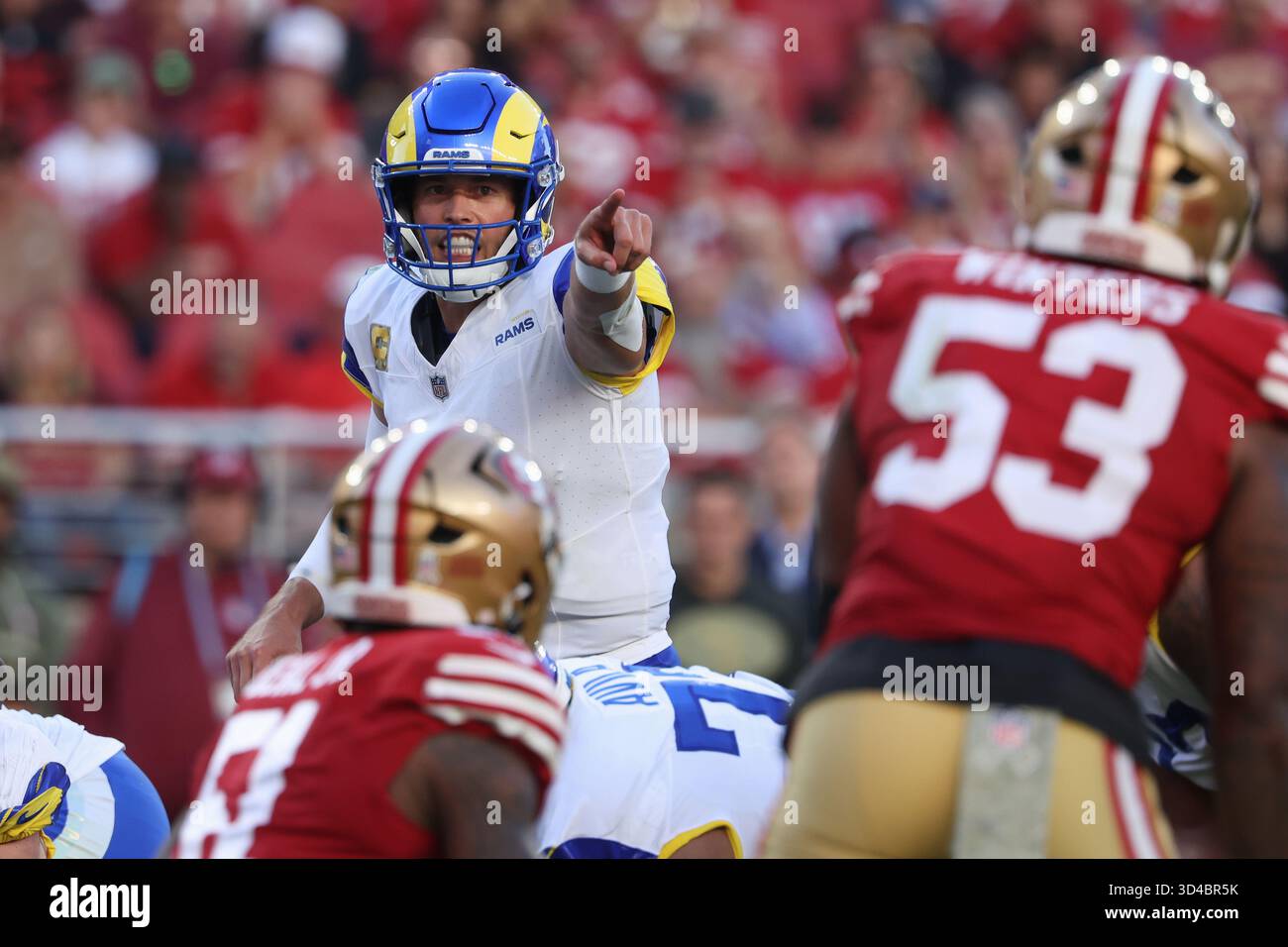 Los Angeles Rams quarterback Matthew Stafford, left, signals at the ...