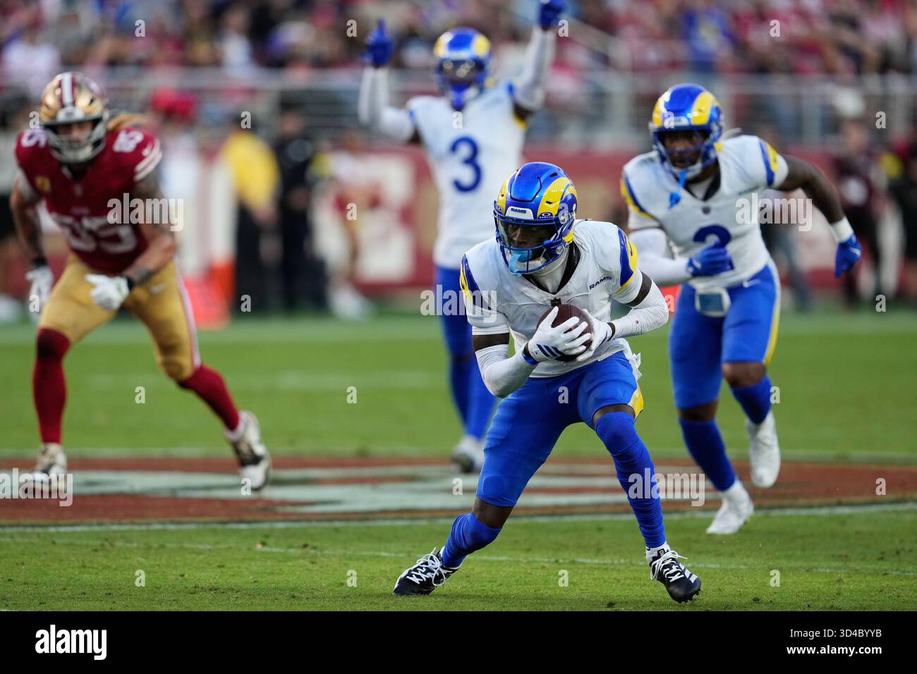 Los Angeles Rams cornerback Emmanuel Forbes Jr., bottom, returns an ...