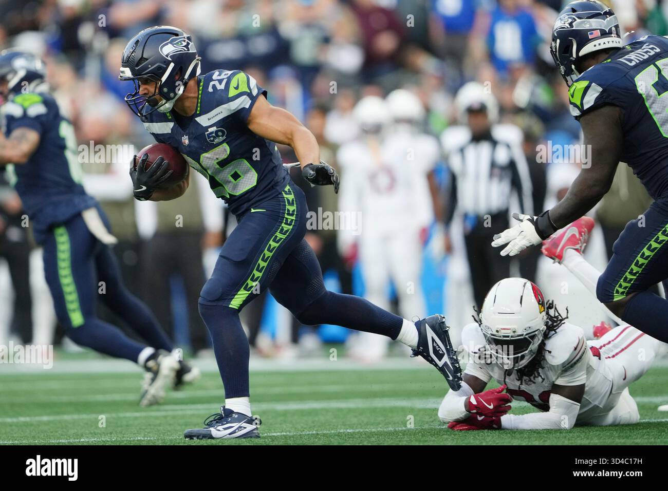Seattle Seahawks running back Zach Charbonnet (26) breaks away from ...