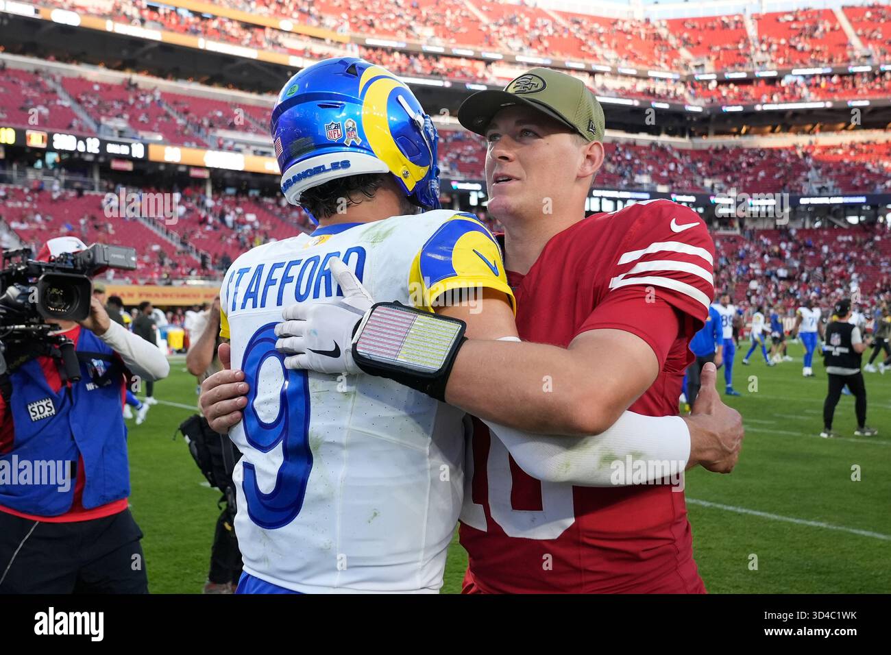 Los Angeles Rams quarterback Matthew Stafford (9) hugs San Francisco ...